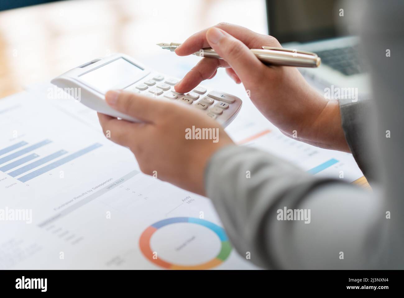 Business analyst concept the accountant calculating to estimate the ...