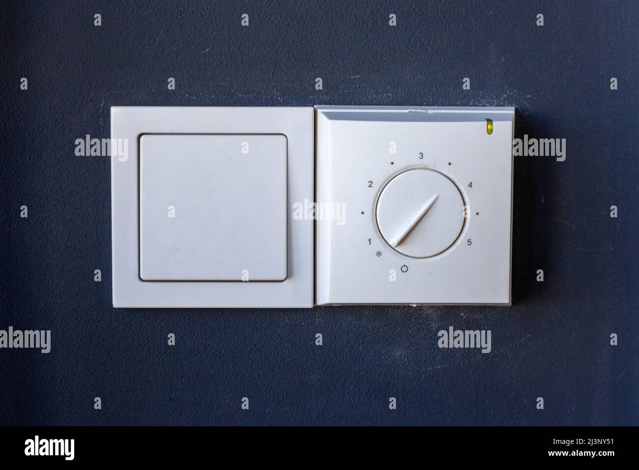 Light switch and underfloor heating adjustment switch Stock Photo - Alamy