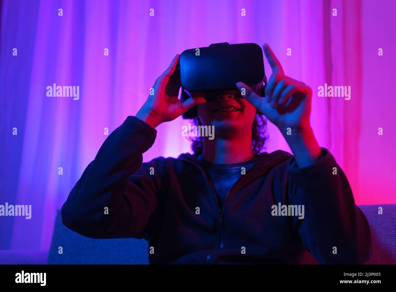 Metaverse technology concept, Man holding VR goggles and pointing to ...