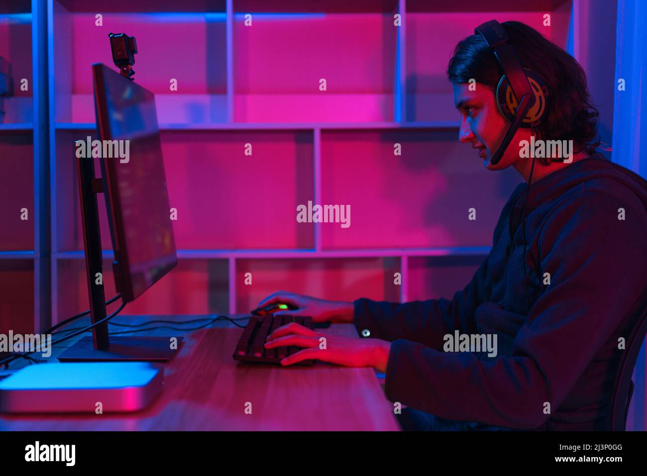 Game stream concept, Male streamer wear headset to play games online ...