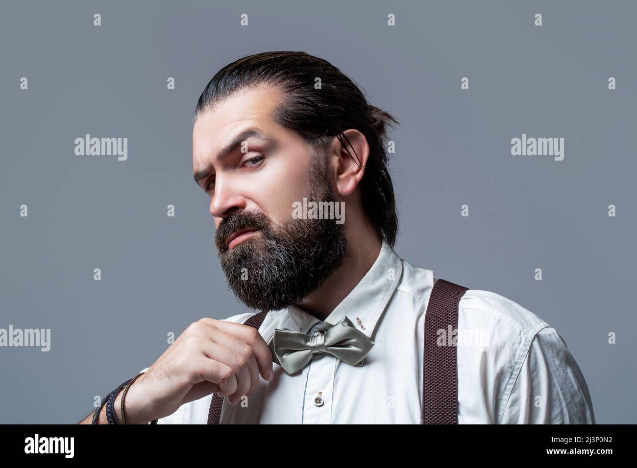 Man wearing white shirt and suspenders hi-res stock photography and ...