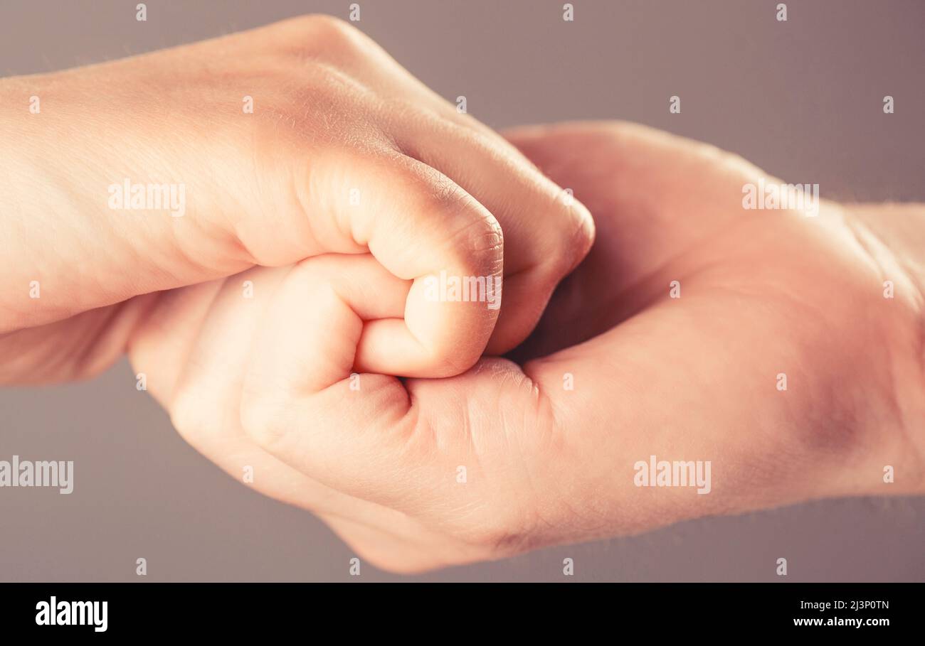 Male and child hands connected each other together and forever. Woman ...