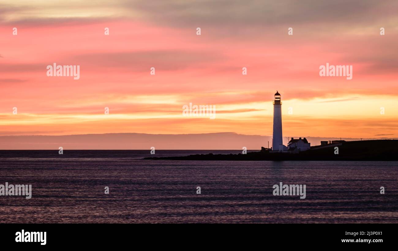 Colourful Sunrise, golden and magenta, on the horizon behind Scurdie ...