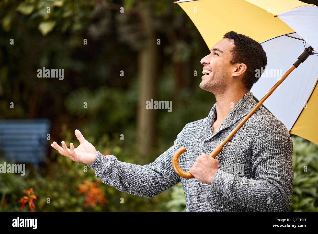 Man alone in rain with umbrella hi-res stock photography and images - Alamy