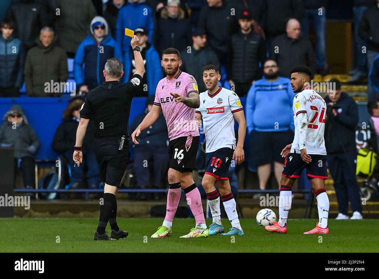 Referee Carl Brook gives a yellow card to Harlee Dean #16 of Sheffield ...