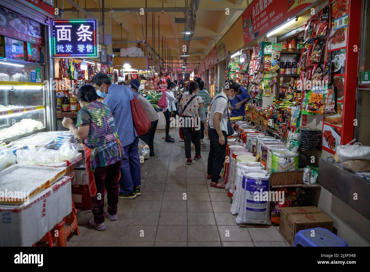 GUANGZHOU, CHINA - APRIL 9, 2022 - Citizens buy supplies at a market in ...