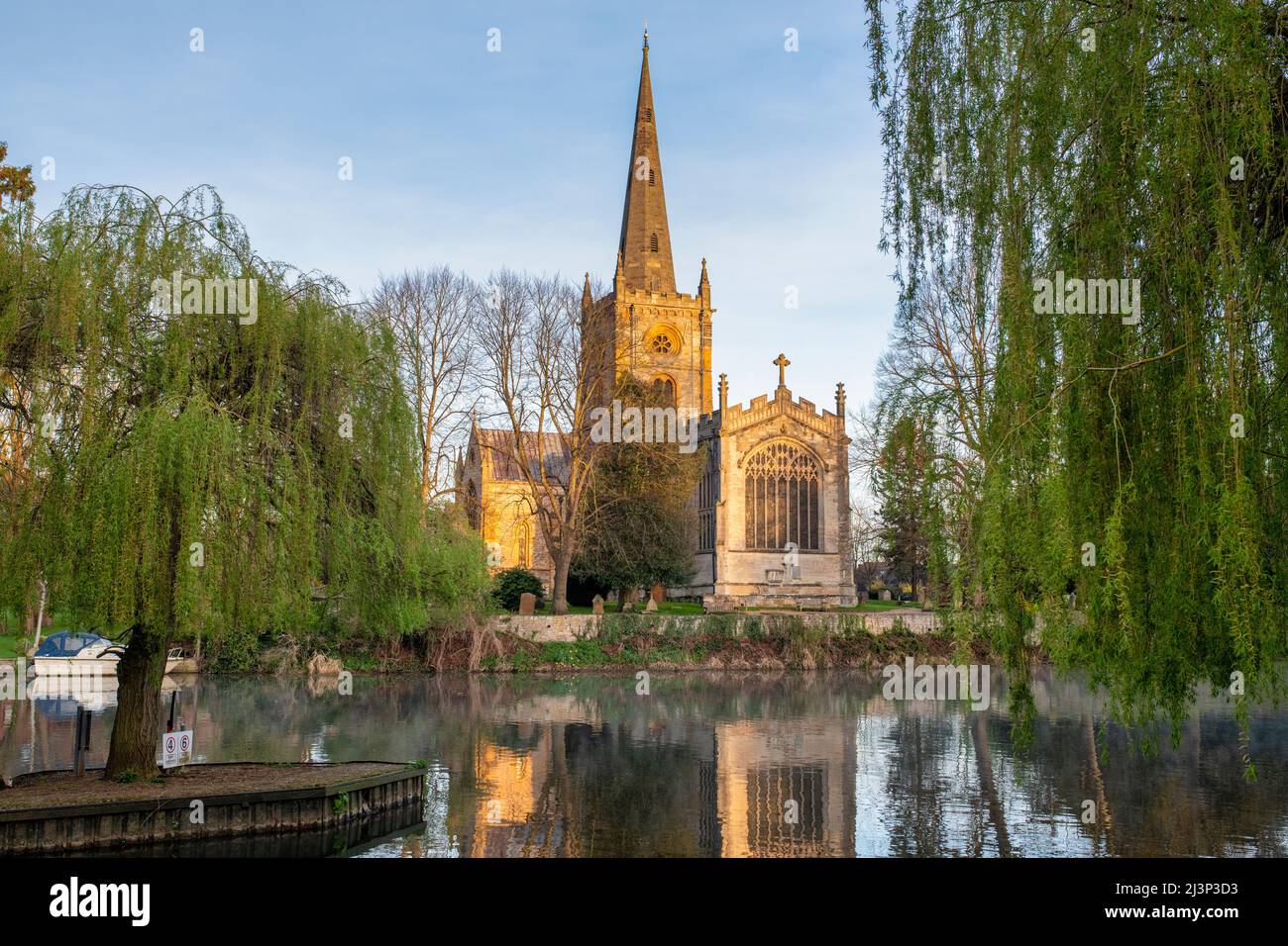The Holy Trinity Church on the banks of the river avon in spring at ...