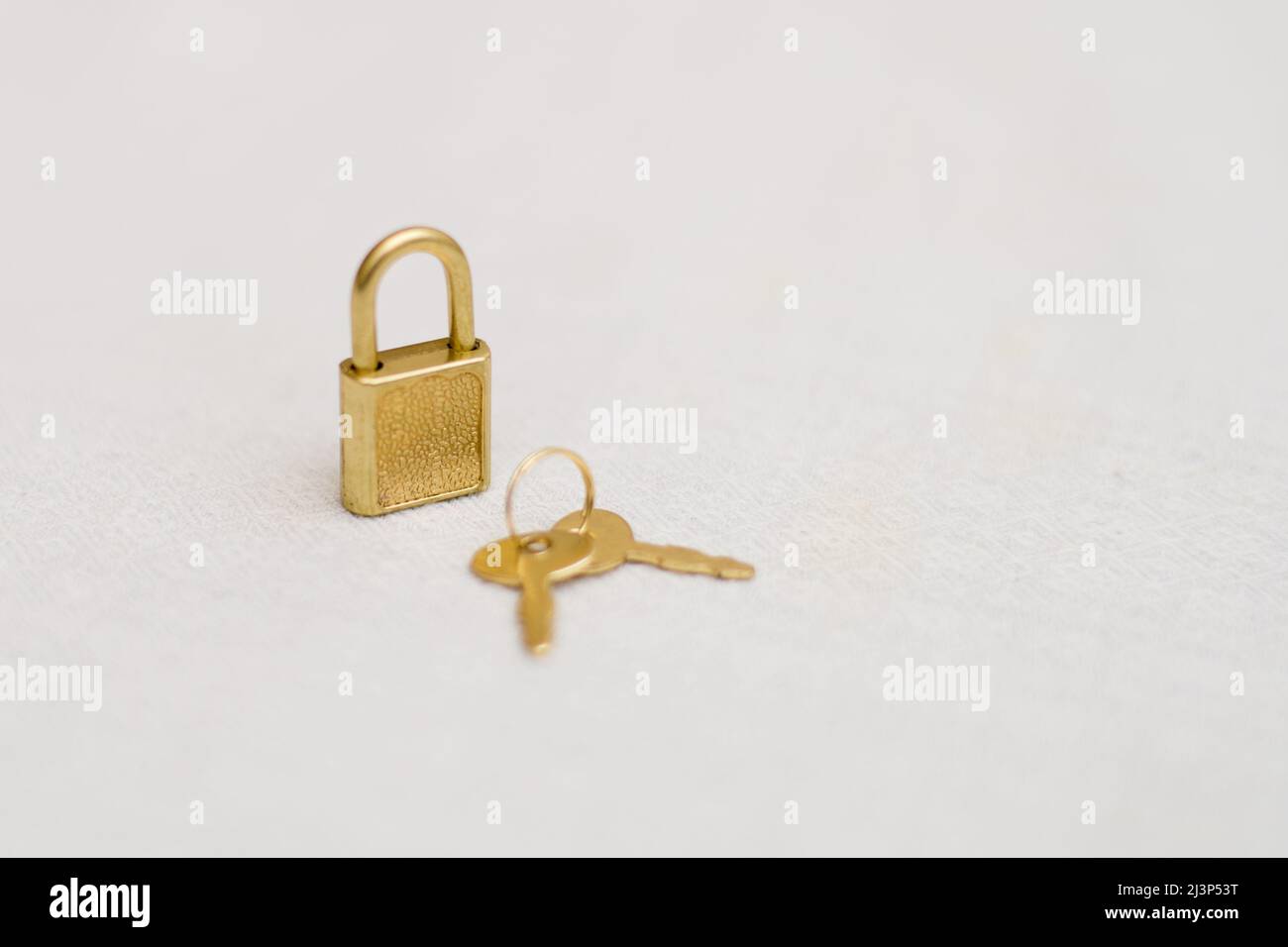 Lock and keys on a white background Stock Photo - Alamy