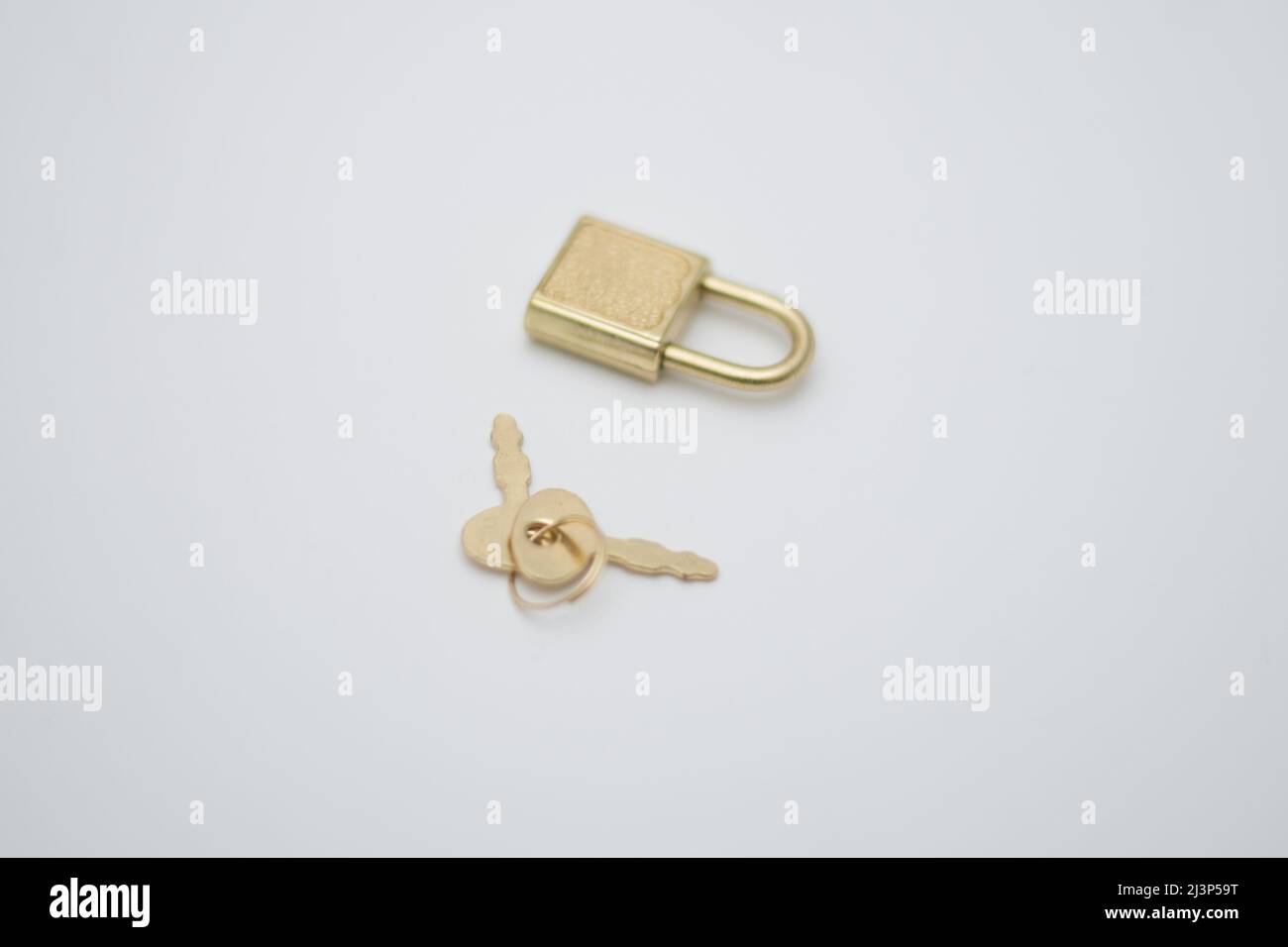 Lock and keys on a white background Stock Photo - Alamy