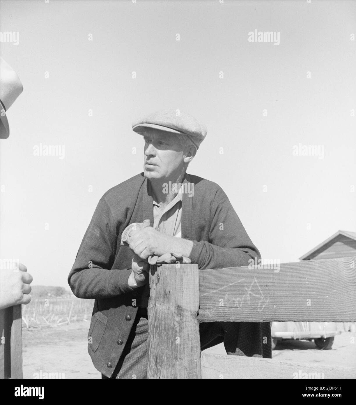 Talking over fence hi-res stock photography and images - Alamy