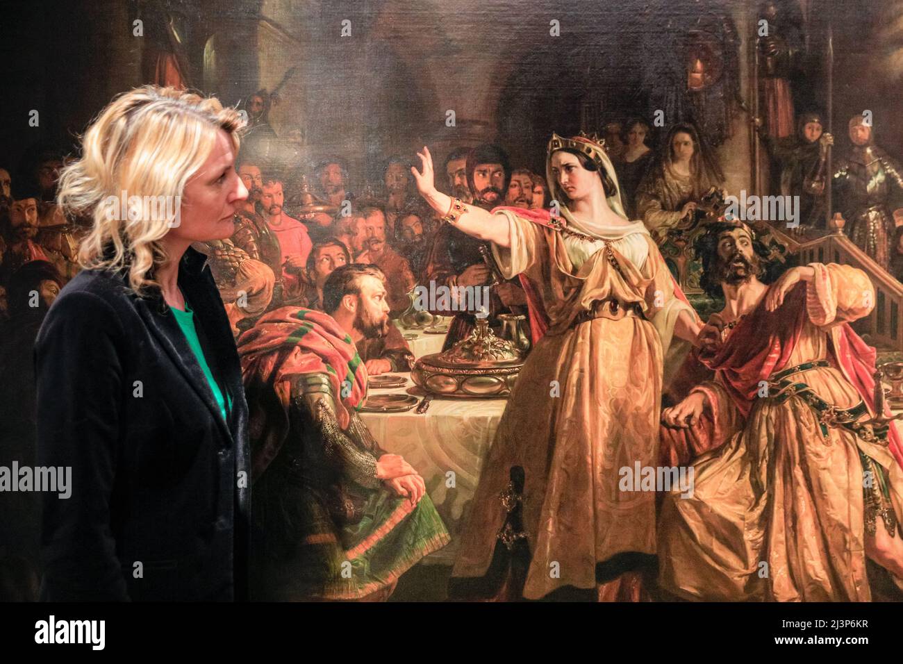 London, UK. 09th Apr, 2022. A gallery volunteer with 'The Banquet Scene ...