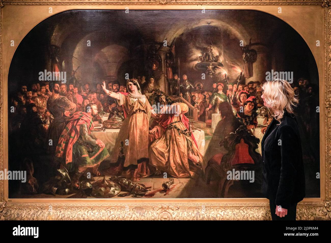 London, UK. 09th Apr, 2022. A gallery volunteer with 'The Banquet Scene ...