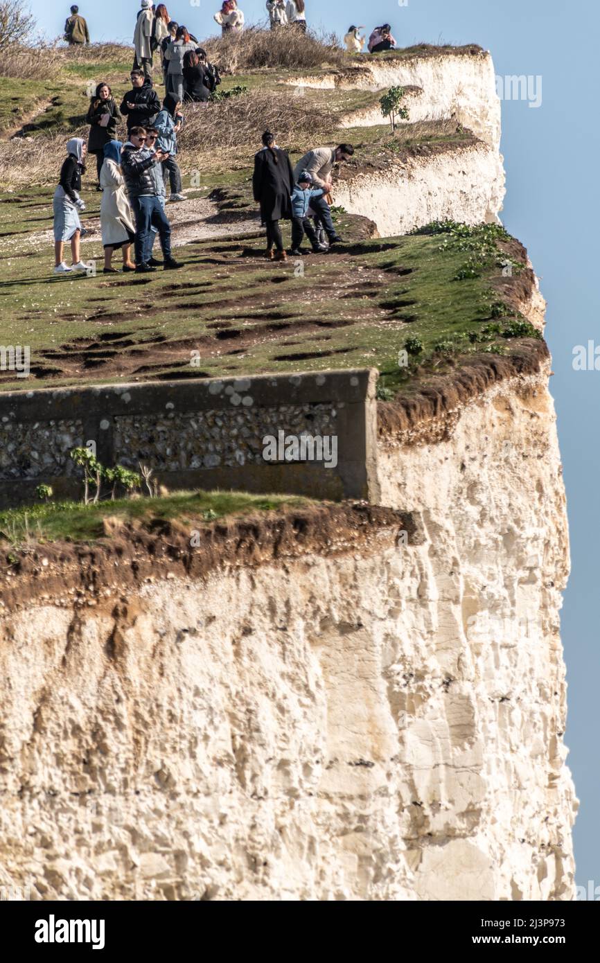 Cliff edge danger, People stand precariously close to the cliff edge at ...