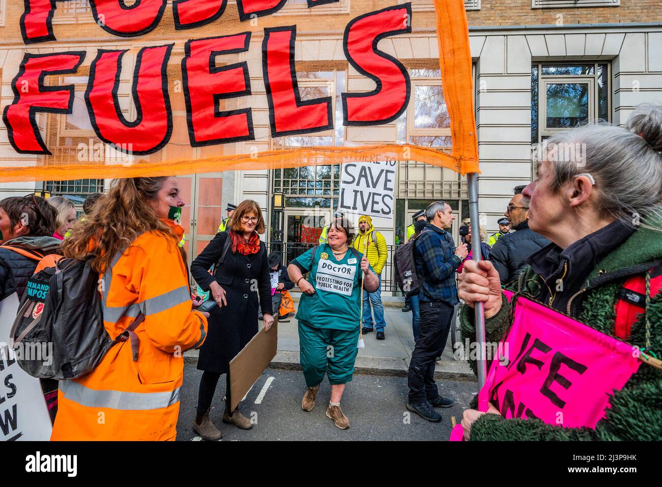 London, UK. 9th Apr, 2022. The march passes and pauses at the HQ of BP ...