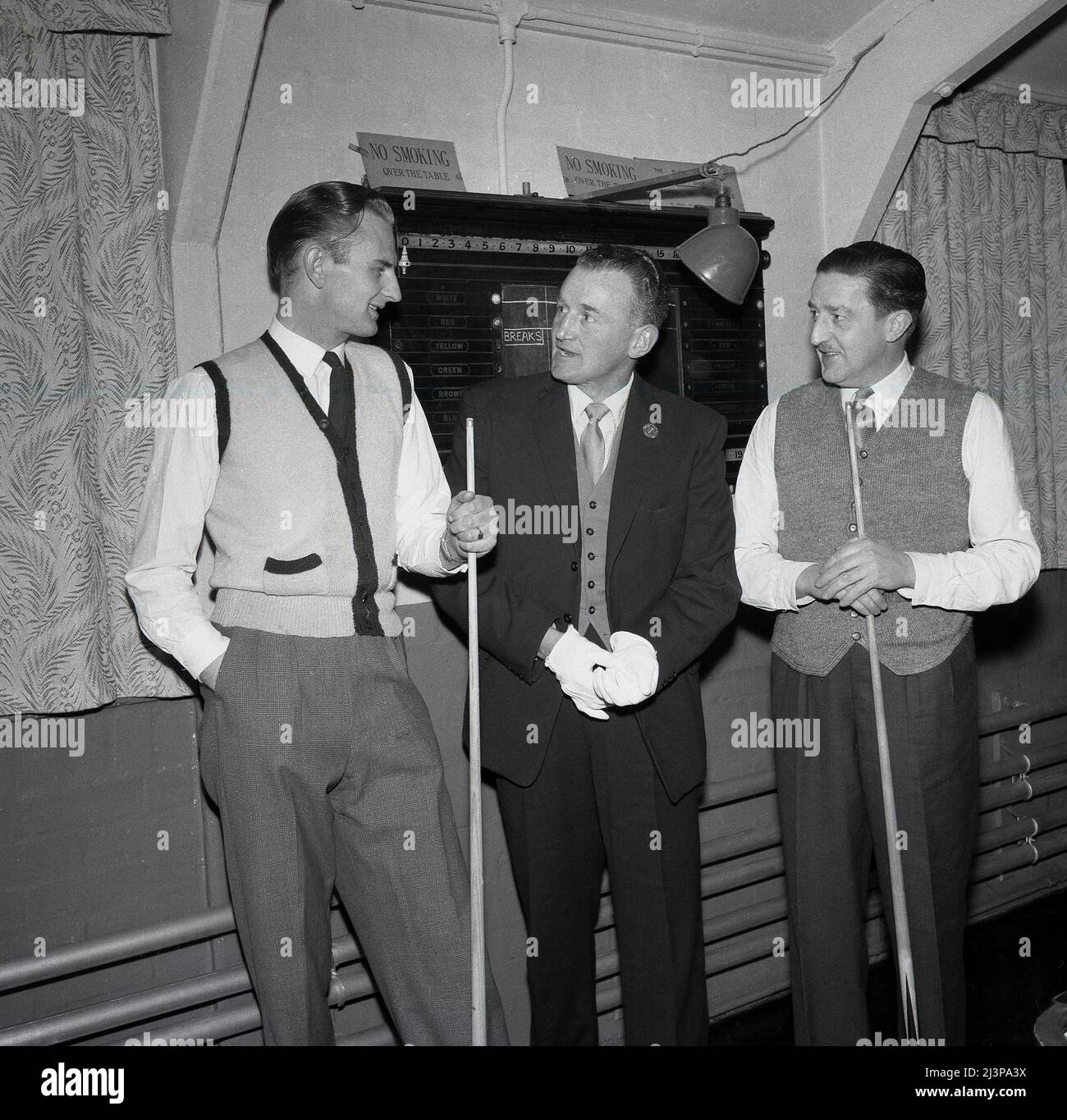 1960, historical, inside a snooker club, two male snooker players in ...