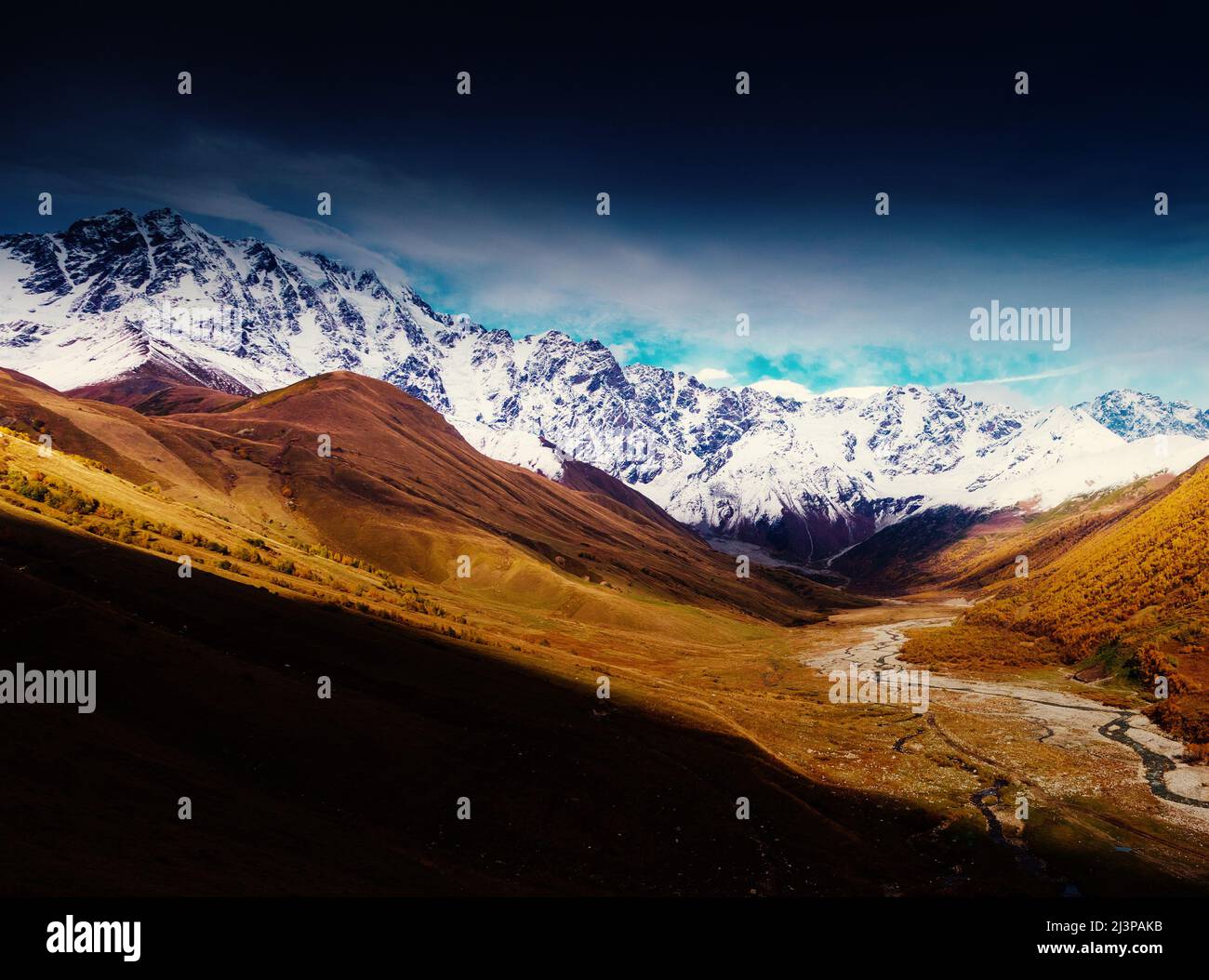 Fantastic view of the alpine valley at the foot of Mt. Shkhara ...