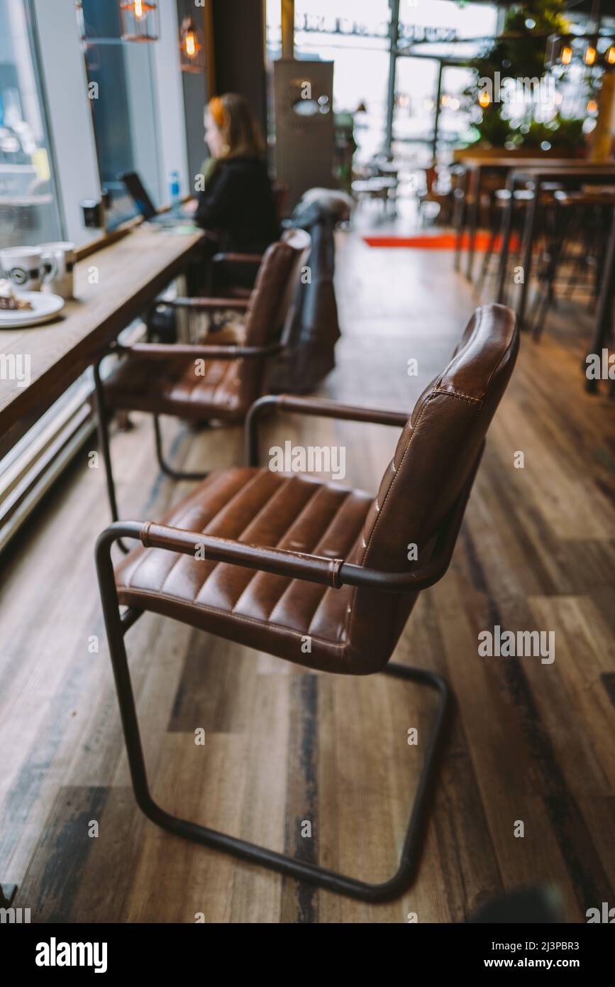 Comfortable leather chair inside indoor restaurant / cafe Stock Photo ...