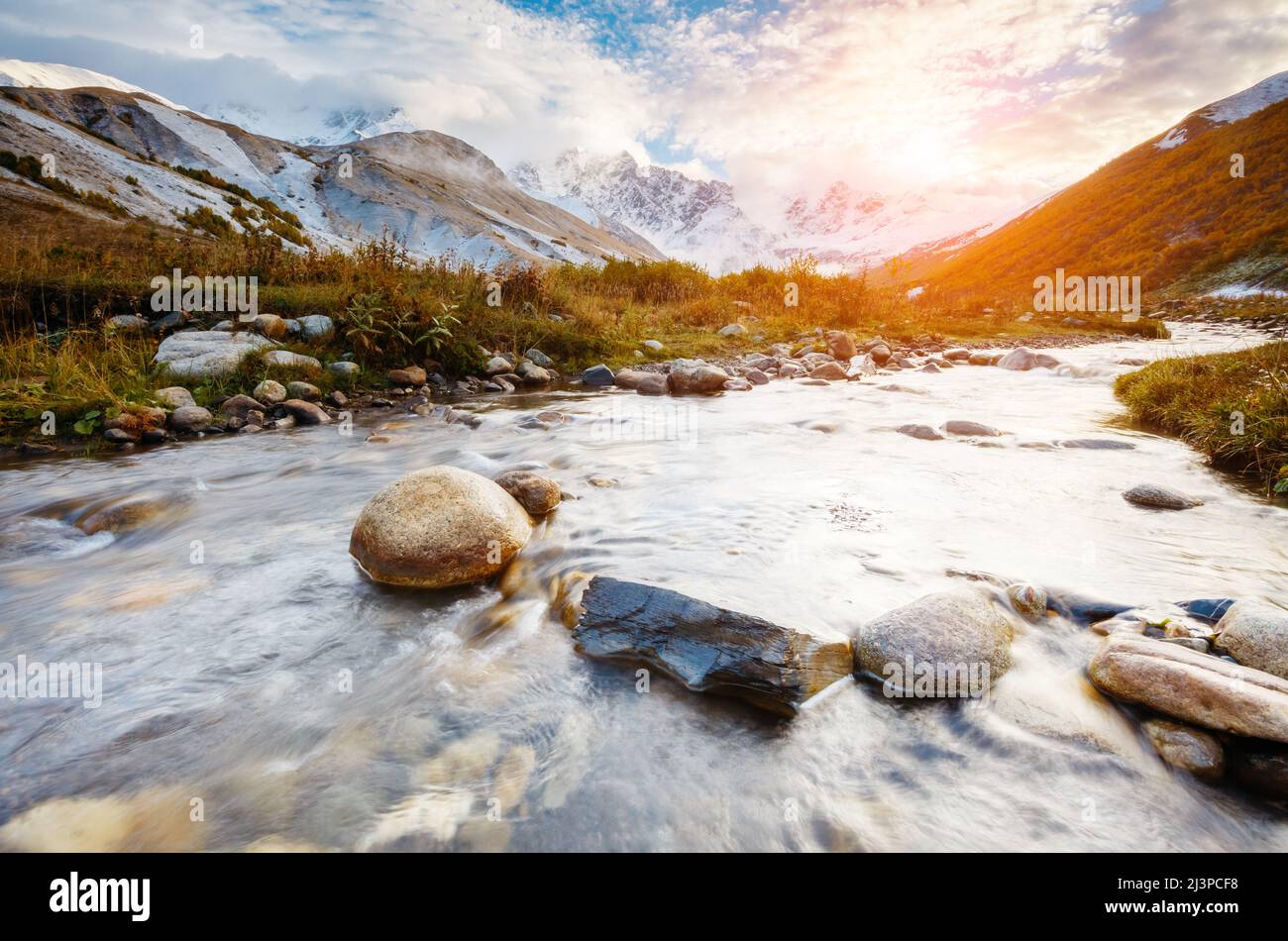 The picturesque view of the mountains that glow under sunlight ...