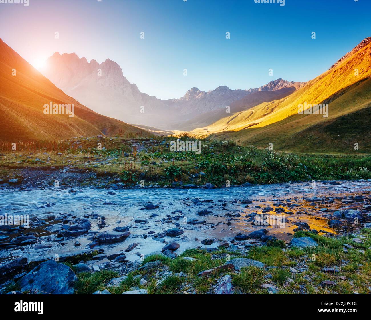 The picturesque view of the mountains that glow under sunlight ...