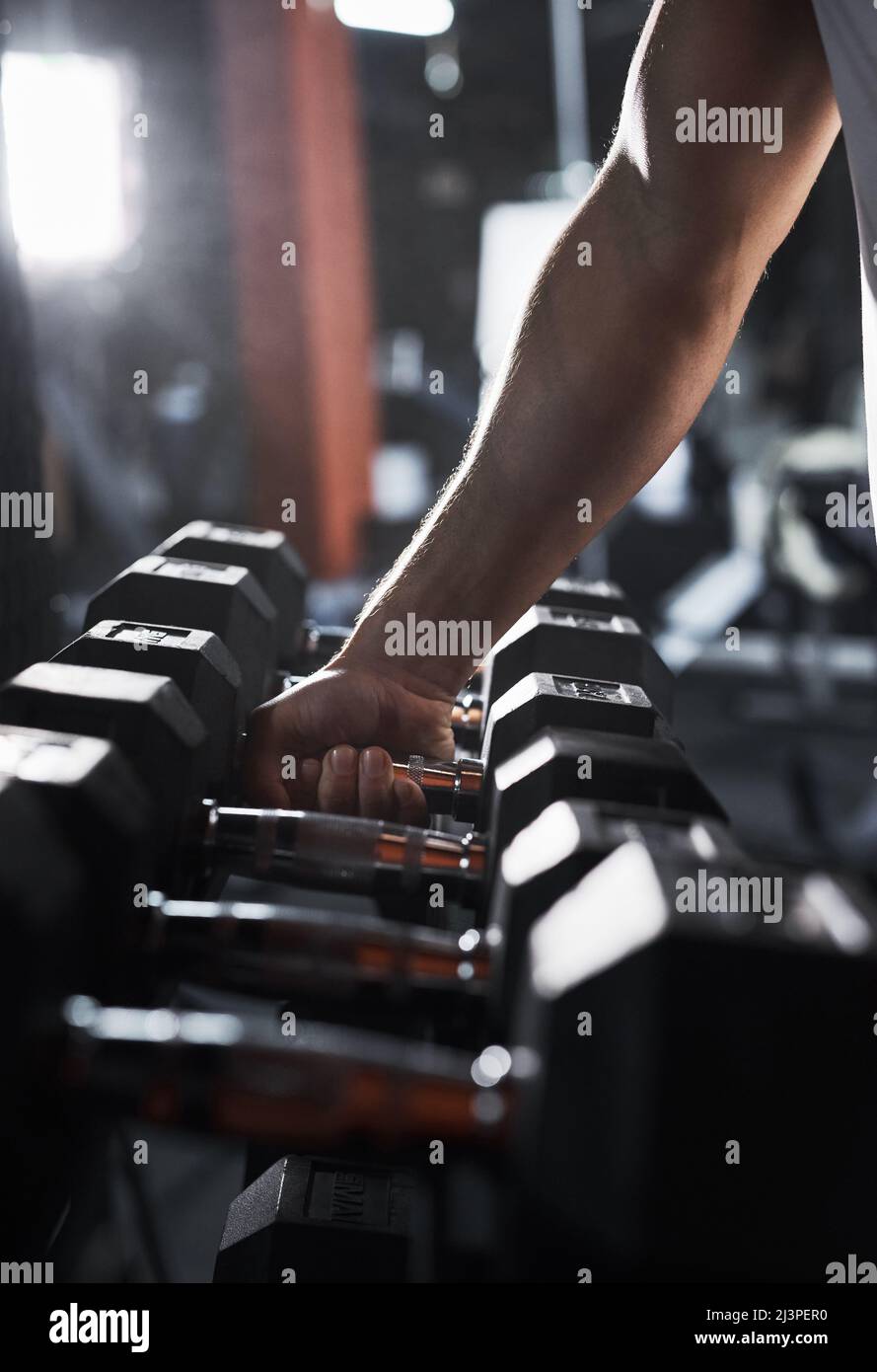 Lets grab a heavier weight. Cropped shot of an unrecognizable male ...