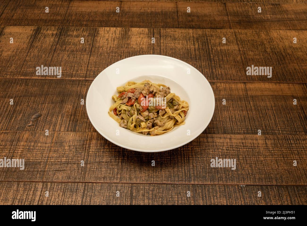 Tagliatelle is a type of elongated dough, small in width and flattened ...