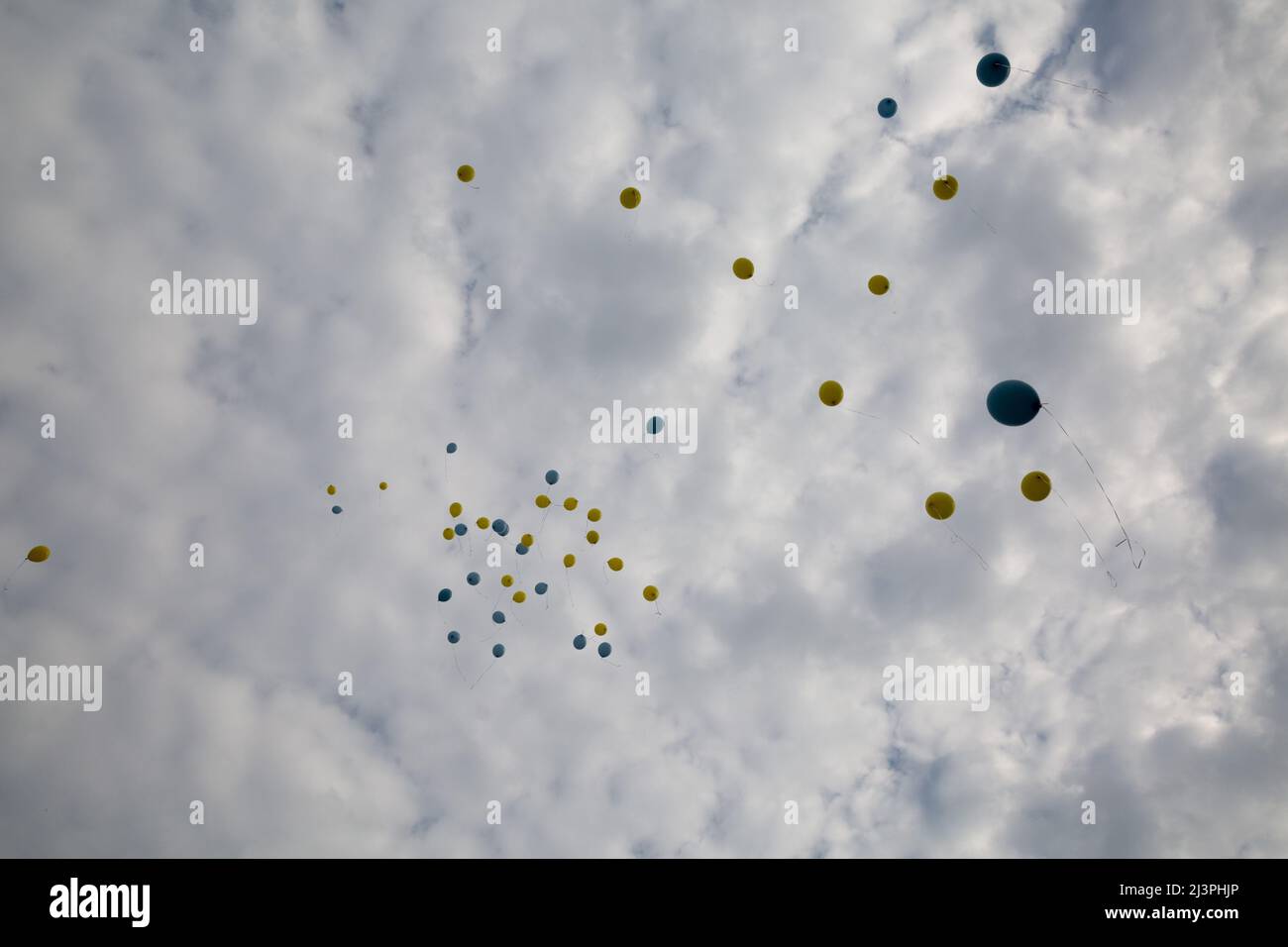 Yellow and Blue Balloons Flying to the Sky Stock Photo - Alamy
