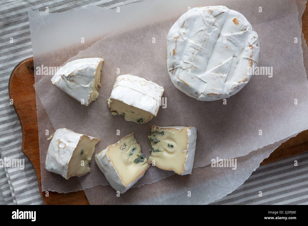 Alpine Blue Cheese on a rustic wooden board, top view. Flat lay ...