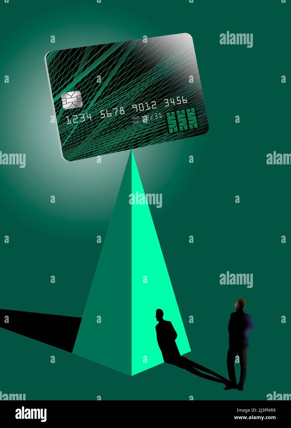 A generic mock credit card or debit card is seen balanced on the ...