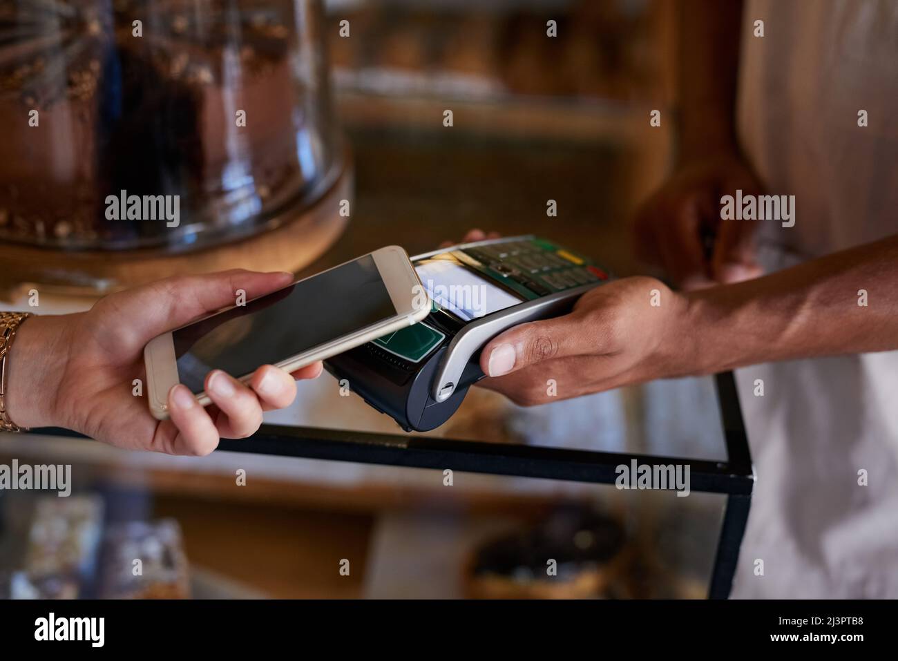 Gone are the days of carrying cash on you. Closeup shot of a customer ...