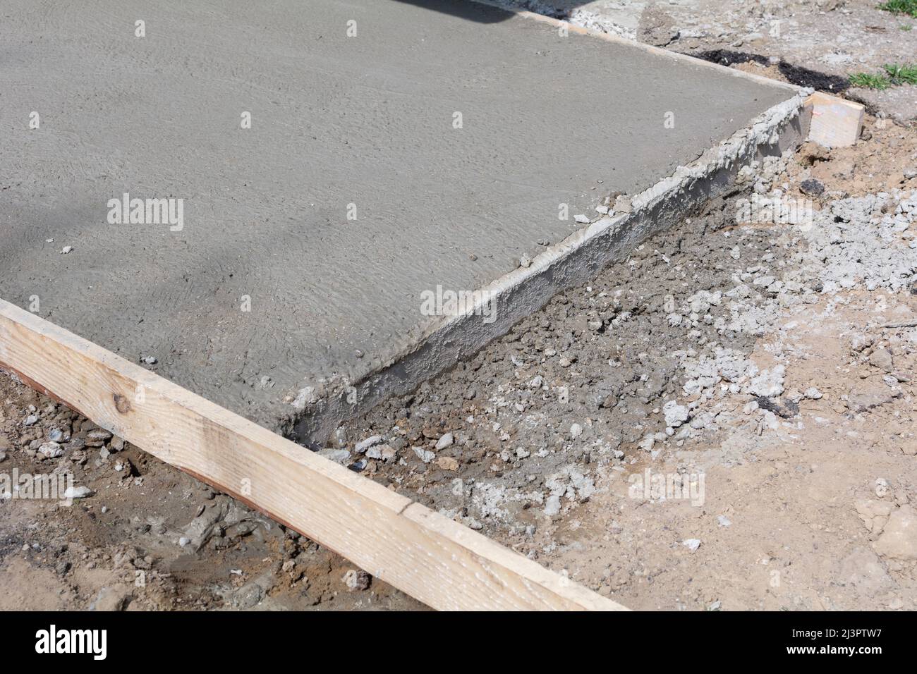 Foundation formwork filled with cement. The process of building the ...