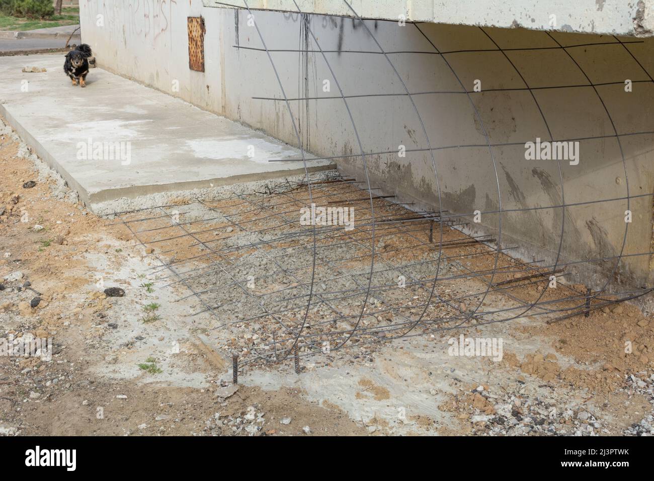 Metal mesh installed over sand and gravel. The process of repairing the ...