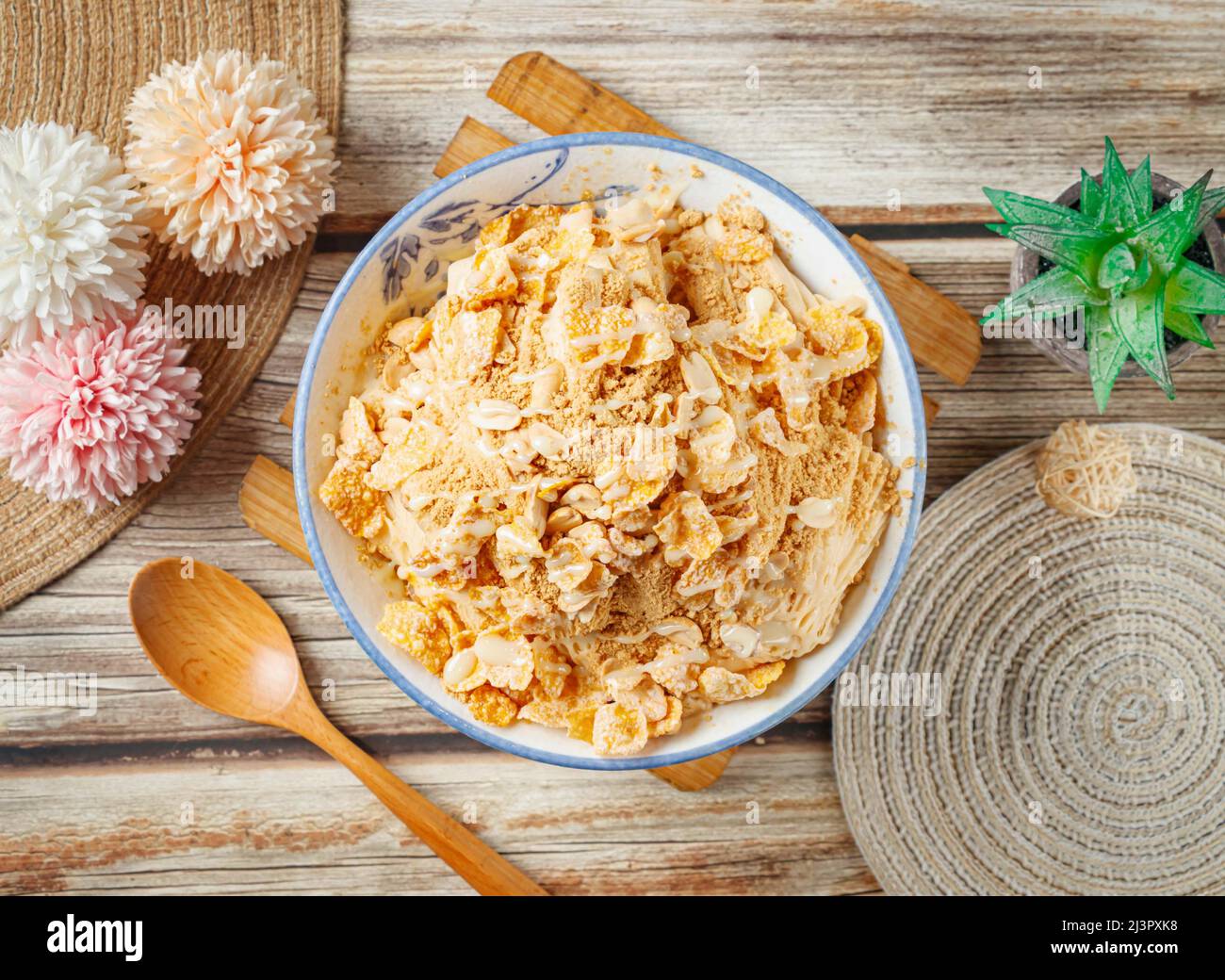 Peanut Noodle Tea Snowflake nimco in a dish top view on wooden table ...
