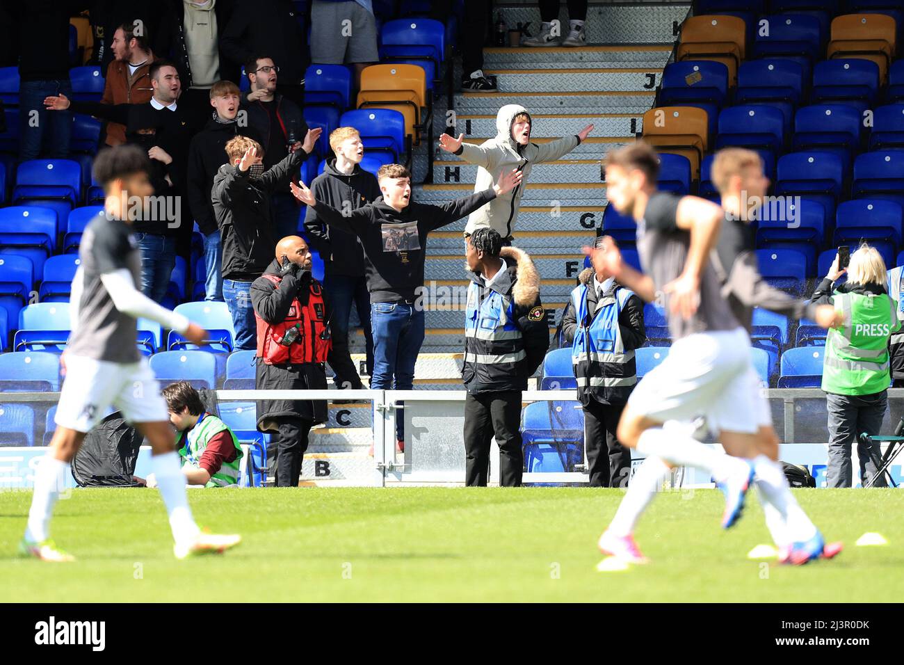 Milton Keynes Dons fans goad AFC Wimbledon fans during the warm up ...