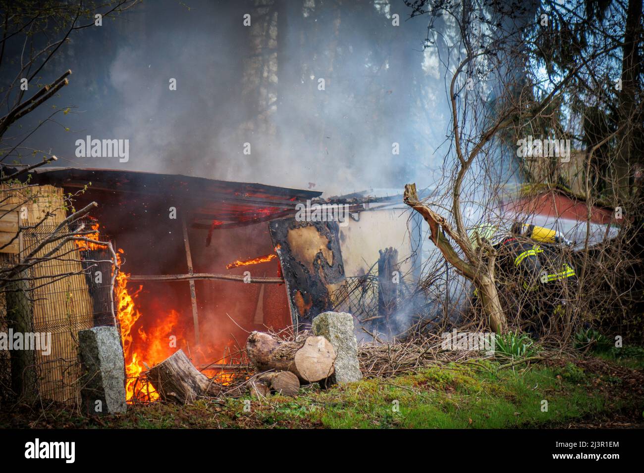 House fire with a garden hose hi-res stock photography and images - Alamy