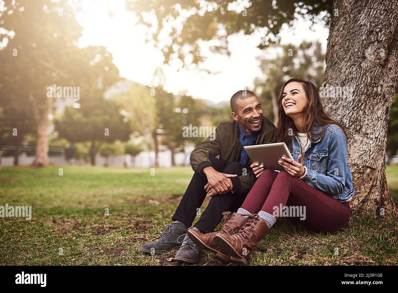 Two people sitting down outside hi-res stock photography and images - Alamy
