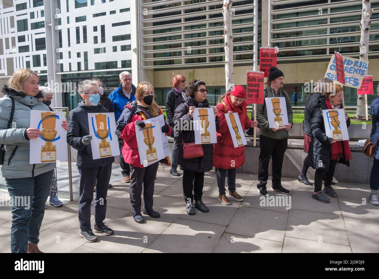 London, UK. 9 Apr 2022. Protesters hold posters to show the message ...