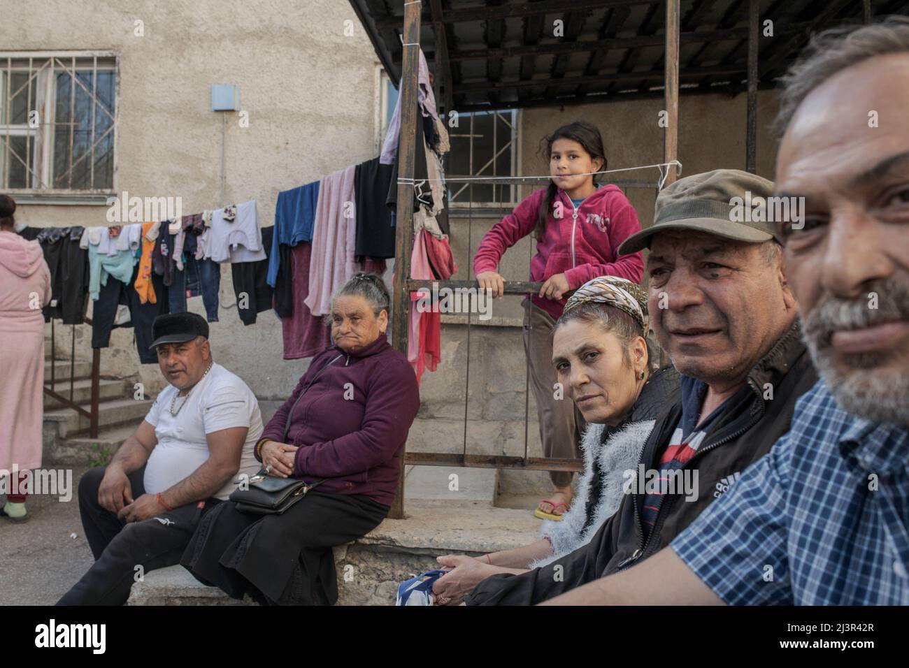 A group of the gypsy community who are refugees spend their afternoon ...