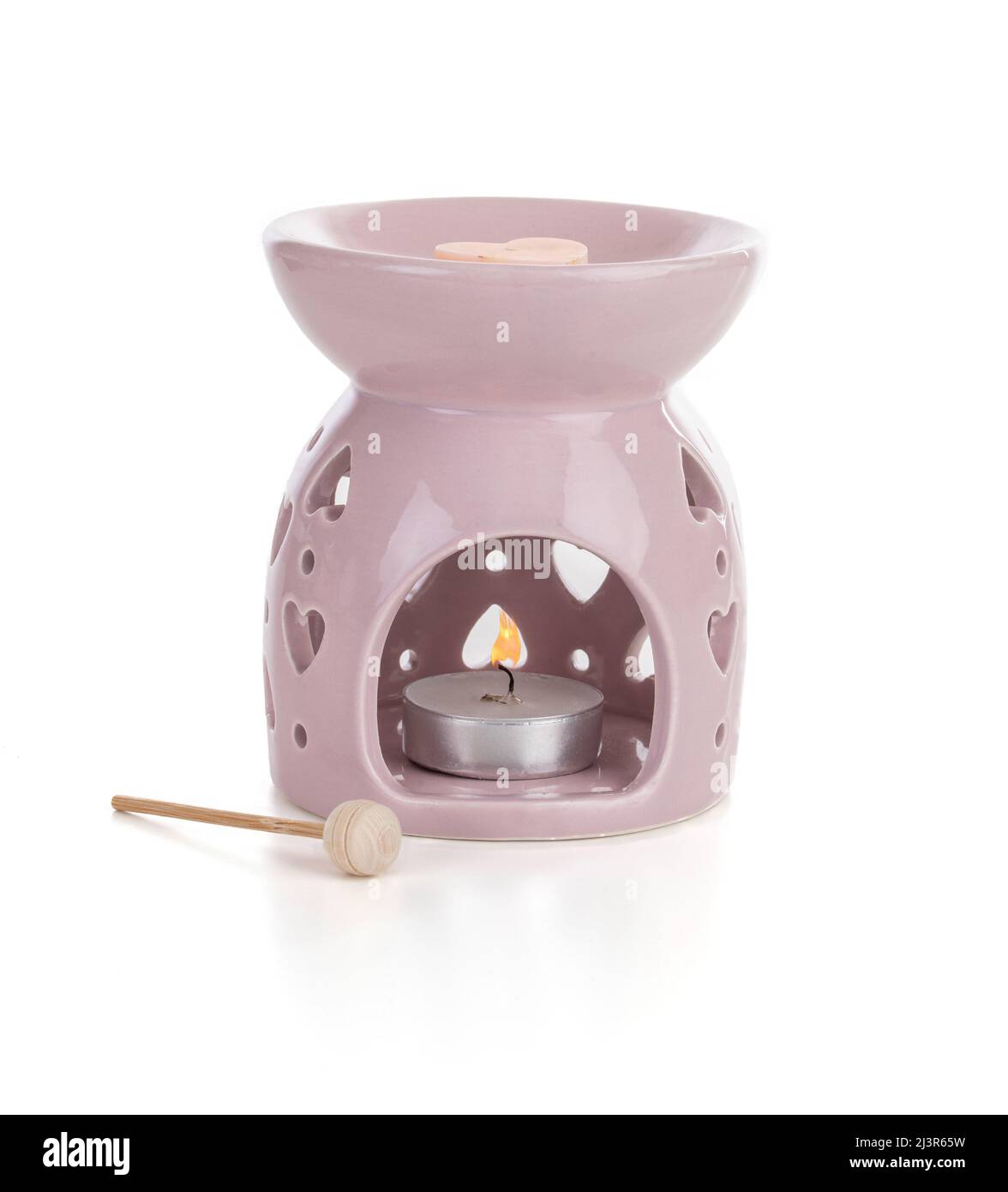 Pink perfume burner with a candle on a white background Stock Photo - Alamy