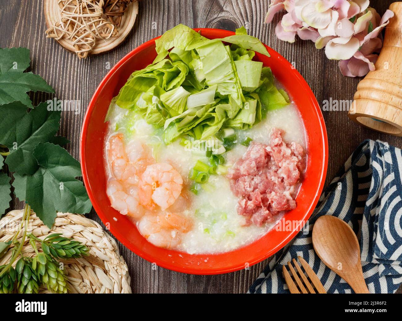 Shrimp Lean Meat Porridge in a bowl top view on wooden table taiwan ...