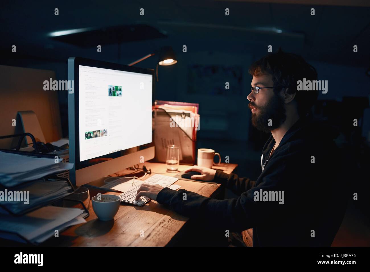 Some late night programming. Cropped shot of a young computer ...