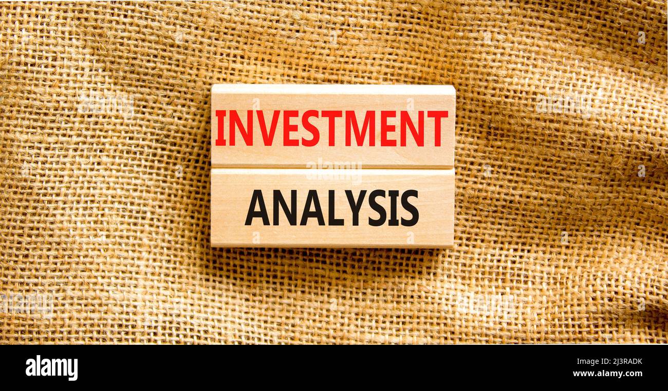 Investment analysis symbol. Wooden blocks with concept words Investment ...