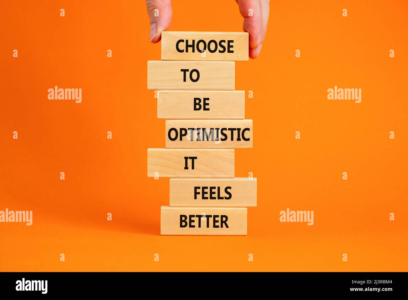 Optimistic is better symbol. Wooden blocks with words Choose to be ...