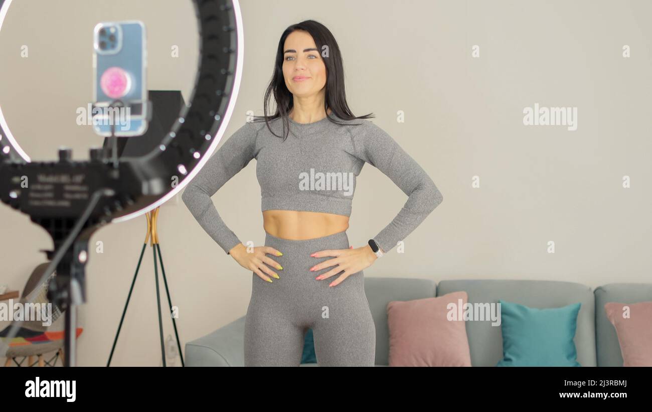 Virtual online fitness. Woman virtual workout at home living room Stock Photo - Alamy