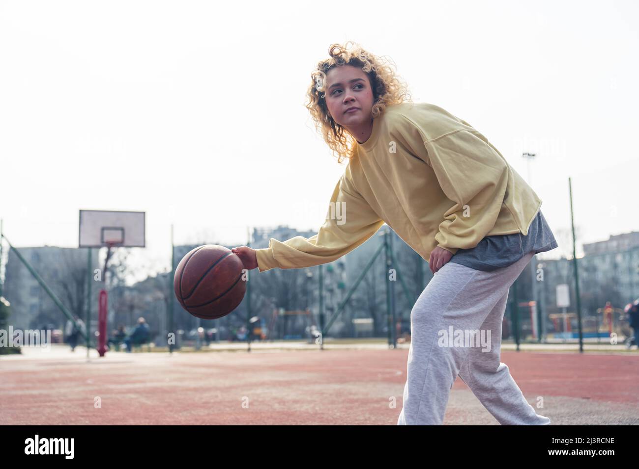 Girl bouncing ball hi-res stock photography and images - Alamy