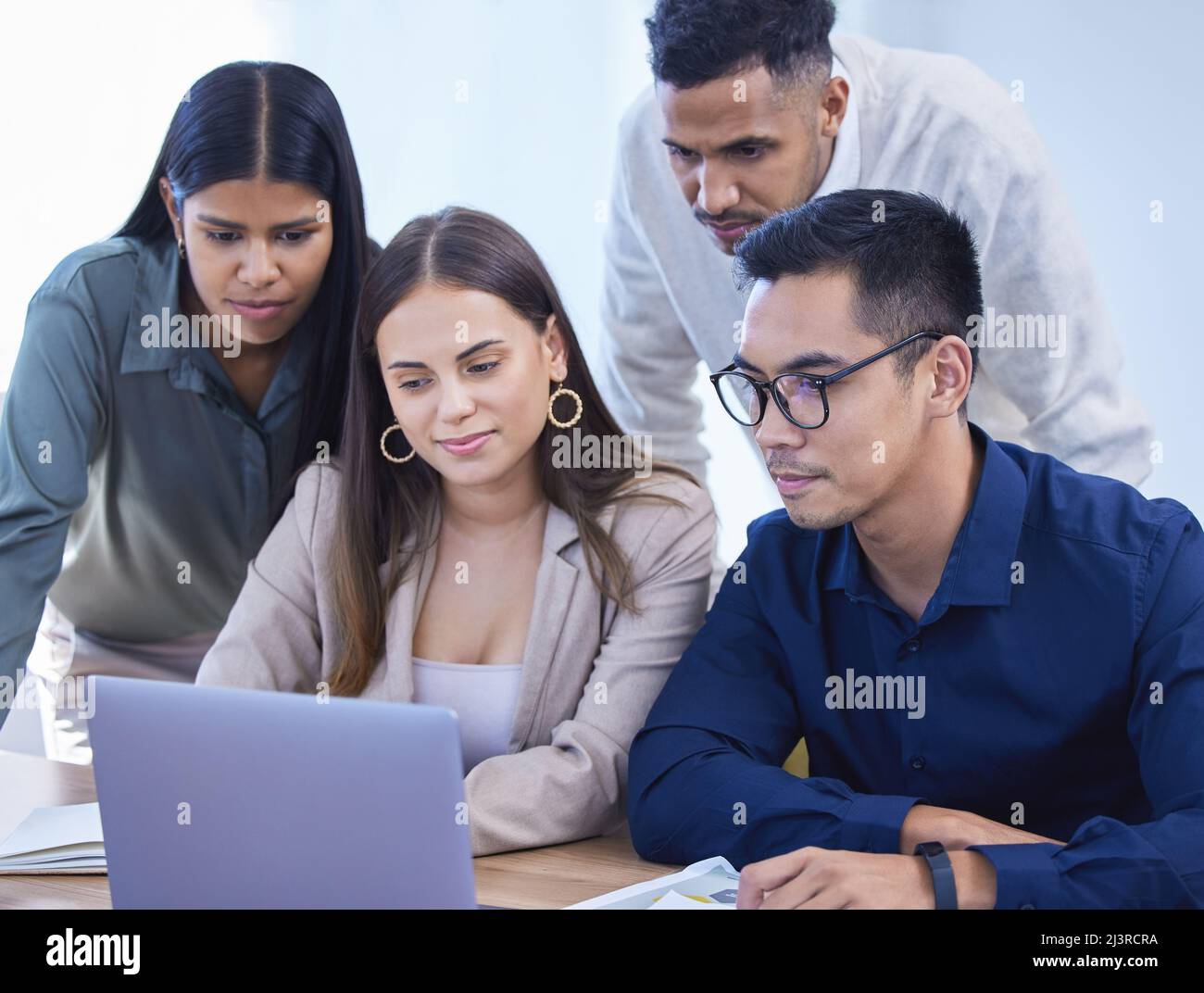 Collaborating to finish their tasks with speed. Shot of a group of ...