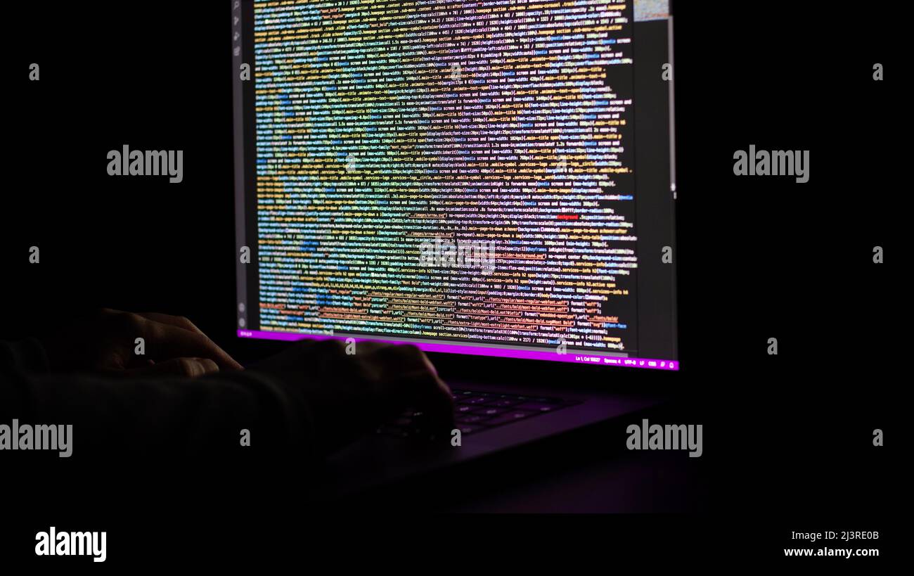 Software developer develops web programming at night Stock Photo - Alamy