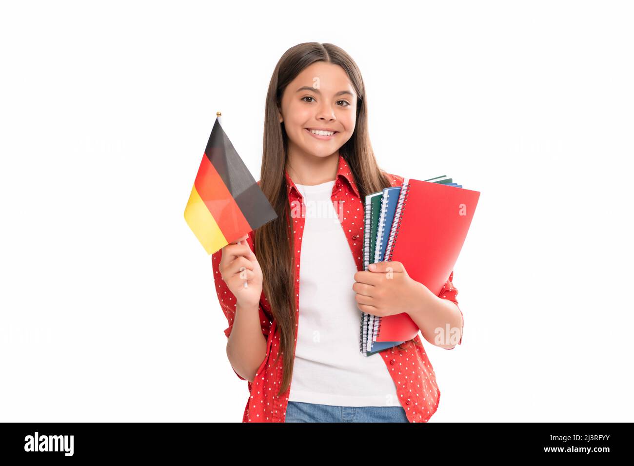 learn foreign language. happy teen girl hold german flag and workbook ...