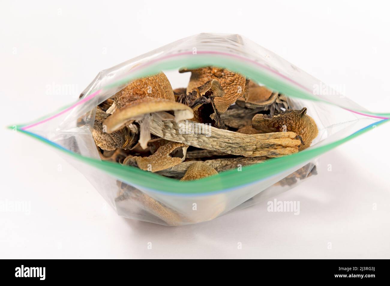 Dried magic mushrooms (psilocybe cubensis) isolated over white ...