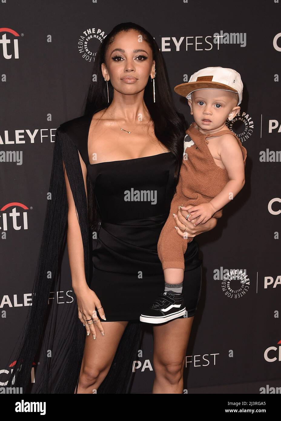 Vanessa Morgan walking on the red carpet at PaleyFest LA 2022 ...