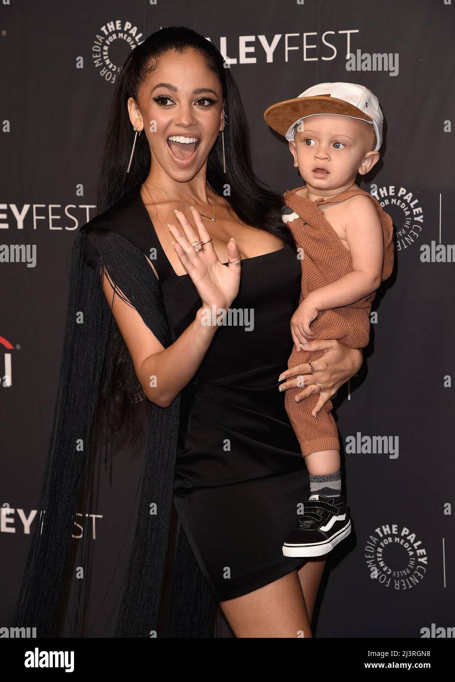 Vanessa Morgan walking on the red carpet at PaleyFest LA 2022 ...